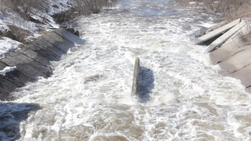 Powerful Flow of Water on the Dam in the Spring after the Ice Stock ...