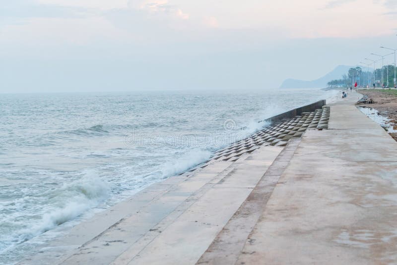 Strong Waves Hit Concrete Sea Barrier in the Evening Editorial Image ...