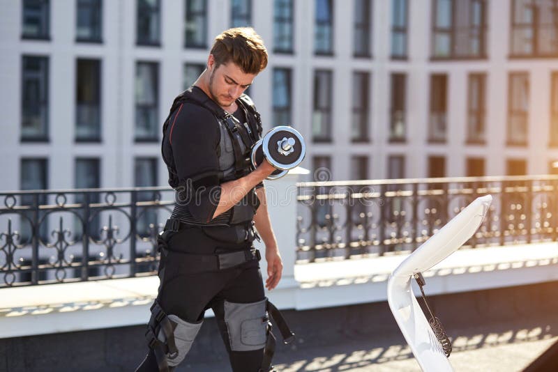 Strong Well-built Guy Doing Dumbbell Curls Stock Photo - Image of happy ...