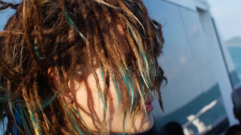Strong Wind Ruffles the Hair of a Girl with Dreadlocks Stock Footage ...