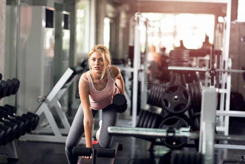Strong Woman Doing Exercises with Dumbbells in Gym Stock Image - Image ...