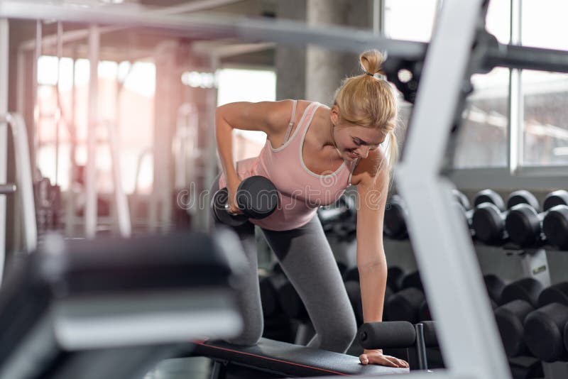 Strong Woman Doing Exercises with Dumbbells in Gym Stock Image - Image ...