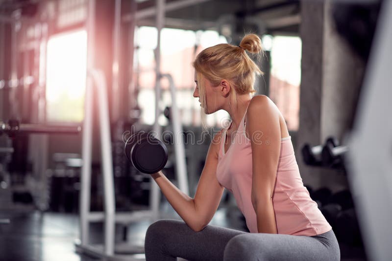 Strong Woman Doing Exercises with Dumbbells in Gym Stock Image - Image ...