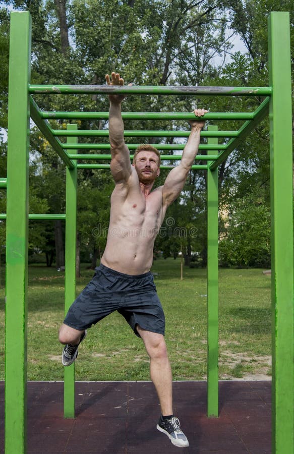Strong Yooung Man Exercise in the Park Stock Image - Image of fitness ...
