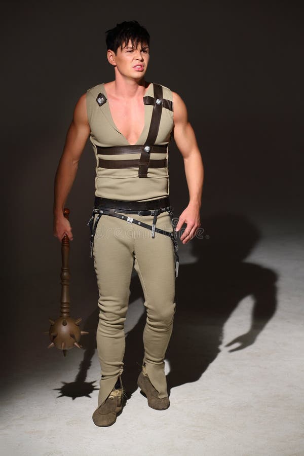 Strong Young Man in a Costume Holding Mace in His Stock Image - Image ...