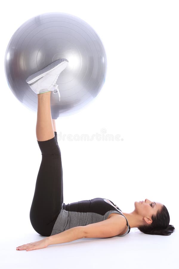 Strong Young Woman Exercising Legs with Ball Stock Image - Image of ...