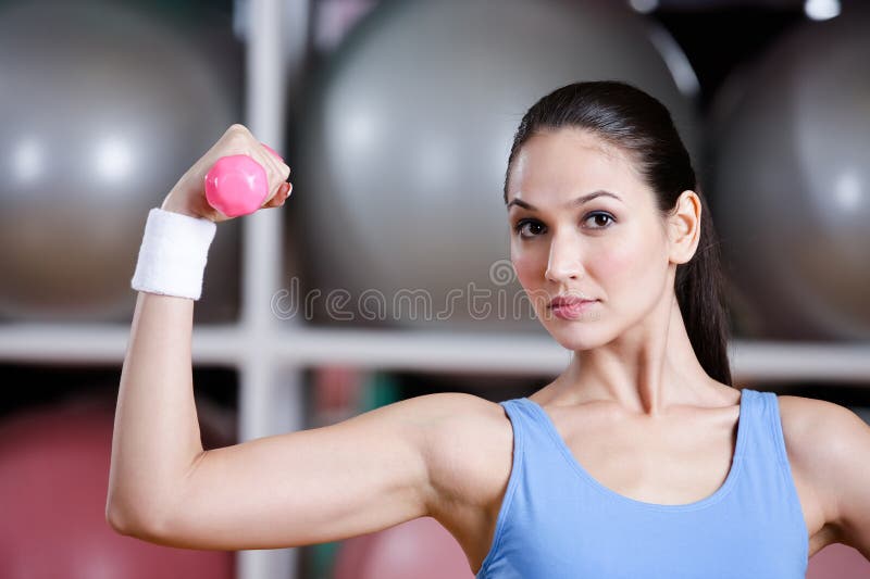 Strong Young Woman Training with Dumbbells Stock Photo - Image of ...