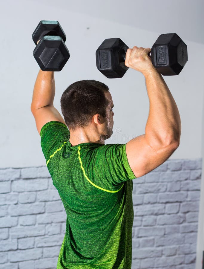 Strongman Doing the Shoulder Exercises in the Gym Stock Image - Image ...