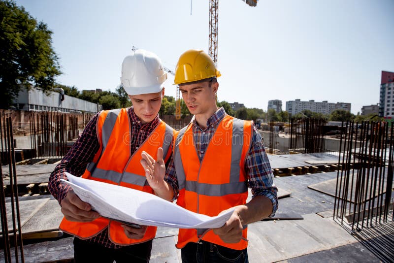 Structural Engineer and Construction Manager Dressed in Orange Work ...