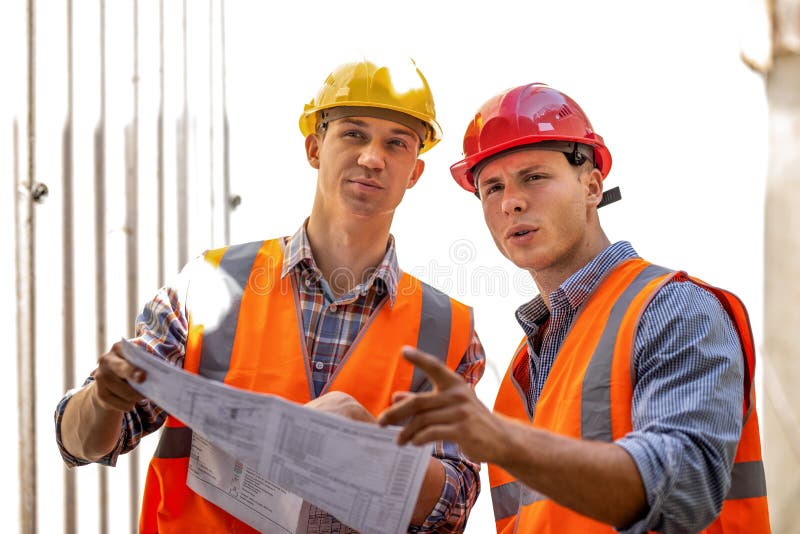 Structural Engineer and Construction Manager Dressed in Work Clothes ...