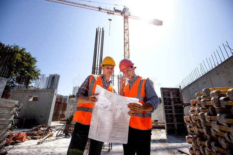 Structural Engineer and Construction Manager in Orange Work Vests and ...