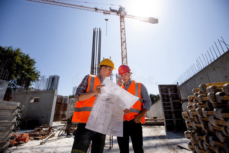 Structural Engineer and Construction Manager in Orange Work Vests and ...
