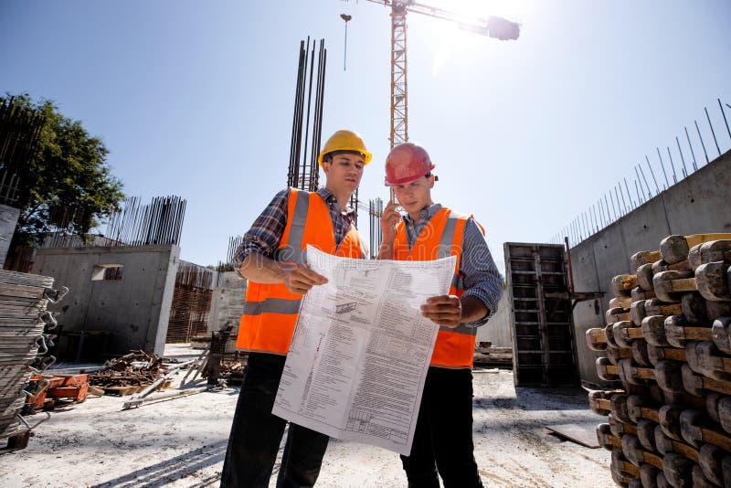 Structural Engineer and Construction Manager in Orange Work Vests and ...