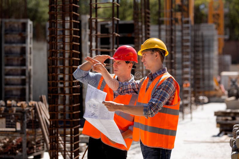Structural Engineer and Construction Manager in Orange Work Vests and ...