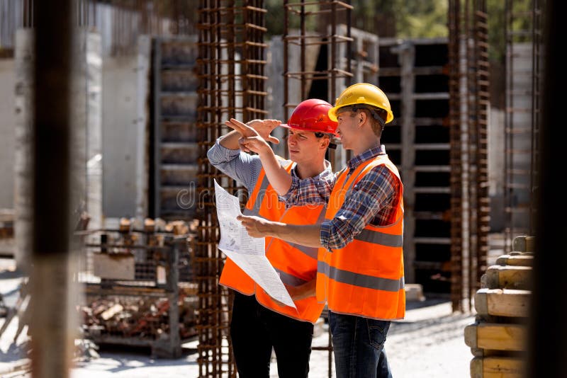 Structural Engineer and Construction Manager in Orange Work Vests and ...