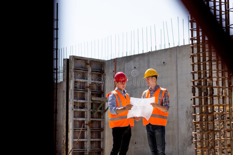 Structural Engineer and Construction Manager in Orange Work Vests and ...