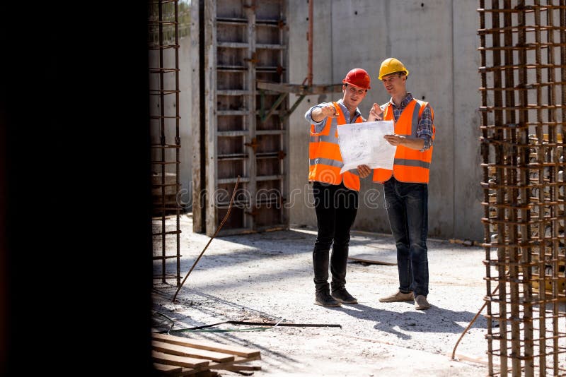 Structural Engineer and Construction Manager in Orange Work Vests and ...