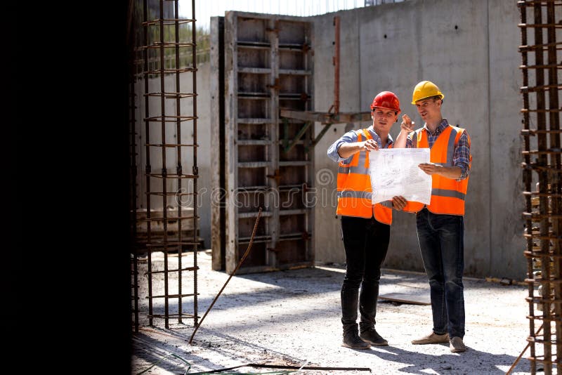 Structural Engineer and Construction Manager in Orange Work Vests and ...