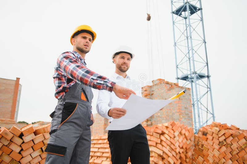 Structural Engineer and Foreman Worker Discuss, Plan Working for the ...