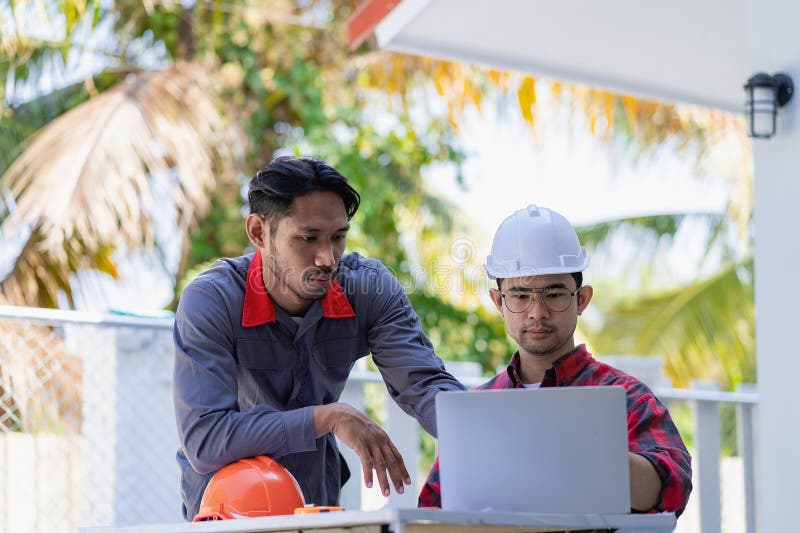 Construction and Structural Concept Engineers Working on Drawings at ...