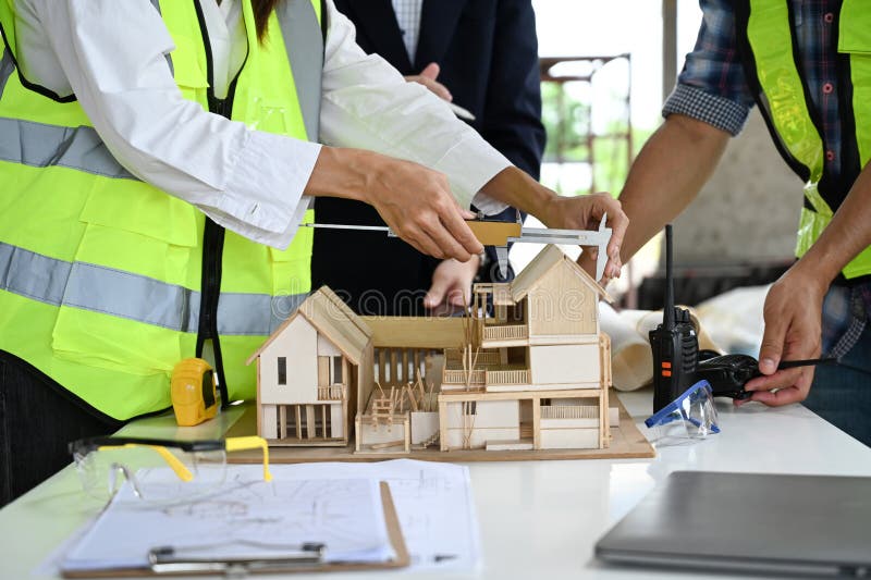 Structural Engineers Team and Businessman Planning Development Details ...