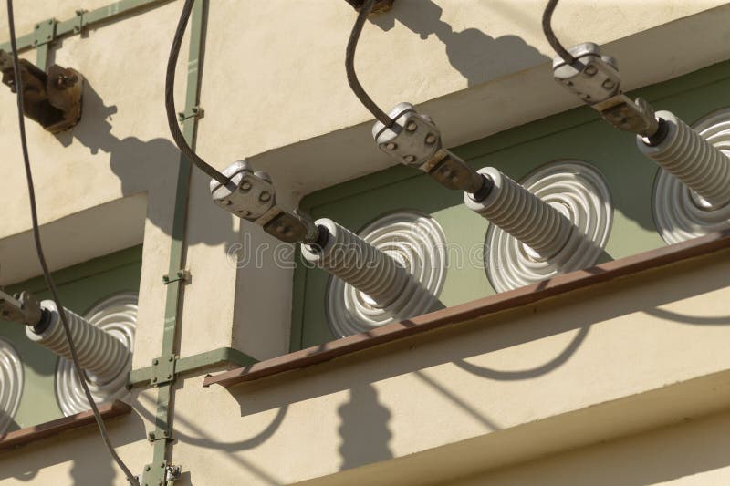 A Large Old Building with a Lot of Wires Hanging Down from it Stock ...