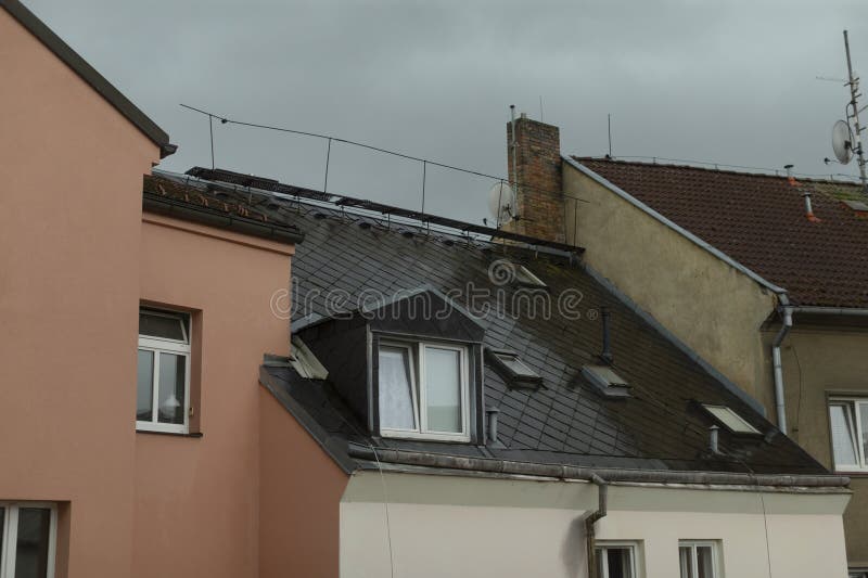 A Structure that Features a Roof Which is Equipped with a Window Stock ...