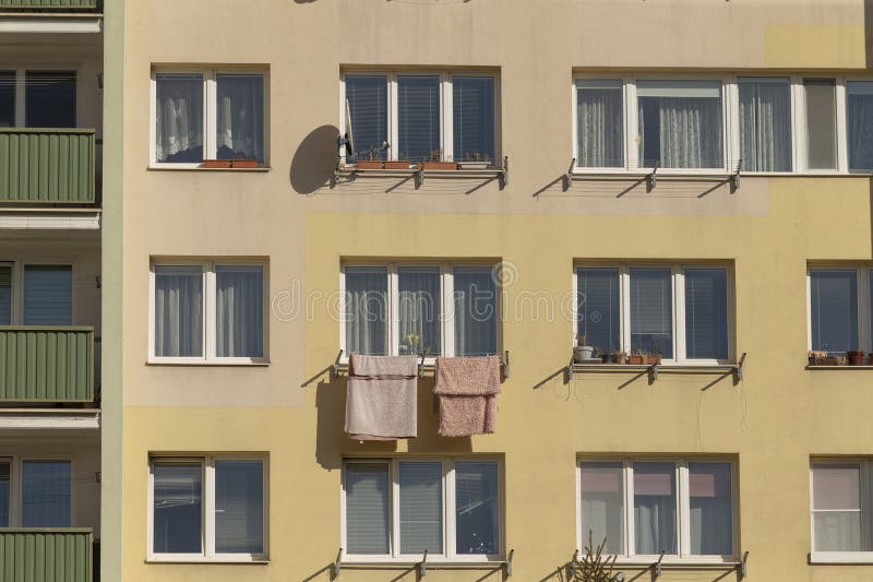 A Building with Many Windows and a Satellite Dish on Top Stock Image ...