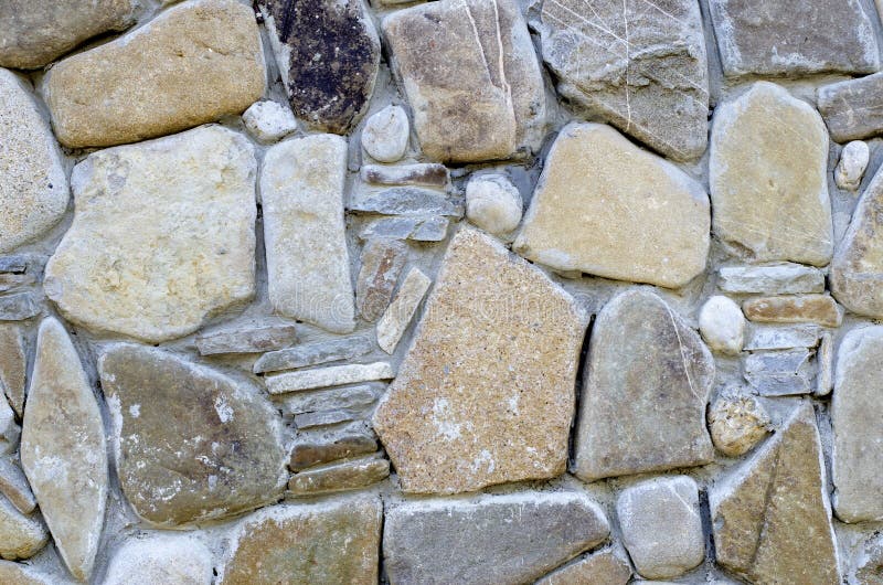 The Structure of a Stone Wall of Coarse Pebble Rocks Close Up Stock ...