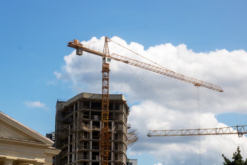 A Structure Under Construction Features a Crane in the Foreground Stock Image - Image of aerial ...