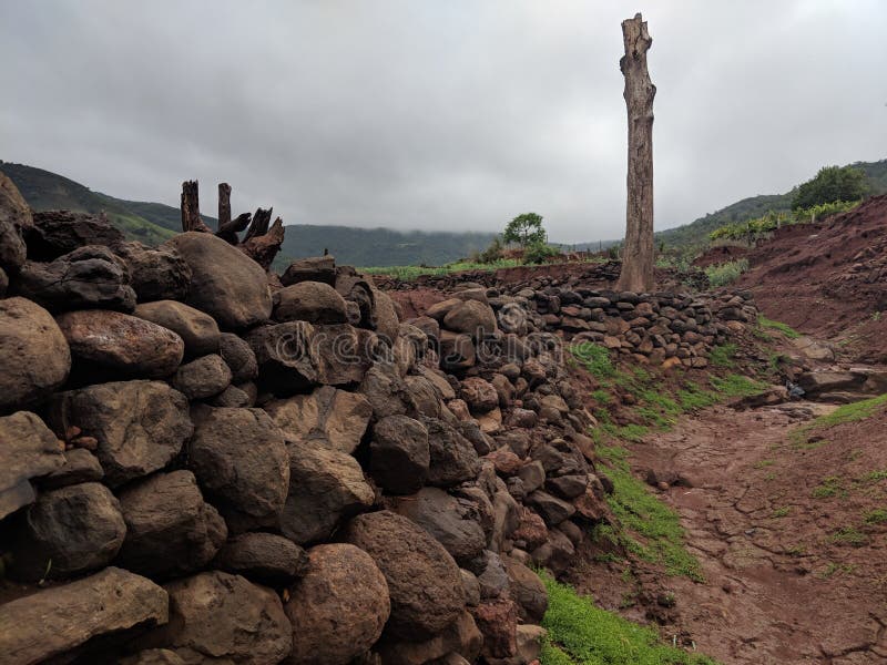Structured rocks stock photo. Image of arranged, river - 128097556