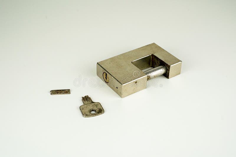 A Stuck Part of a Broken Key on a Padlock Lock Stock Photo - Image of ...