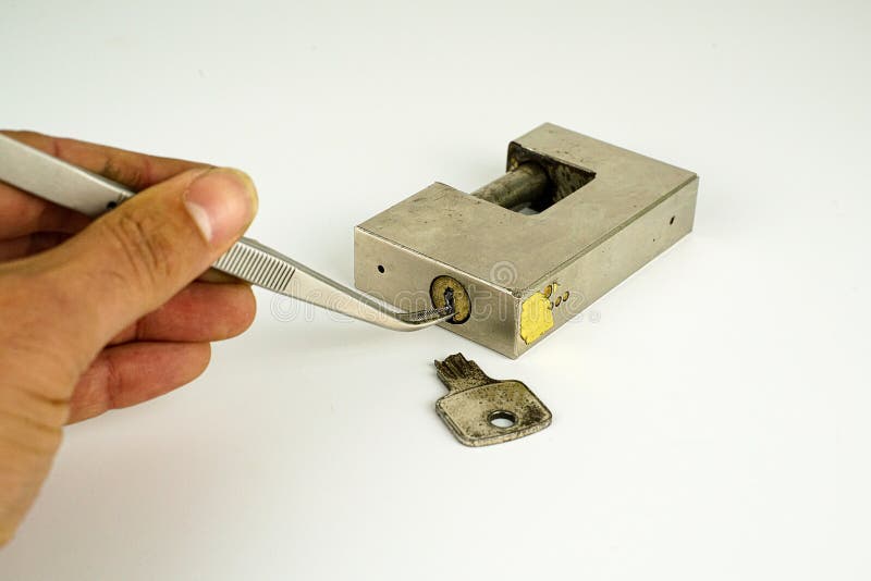 Stuck Part of a Broken Key on a Padlock Lock. Stock Photo - Image of ...