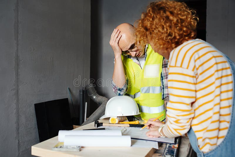 Stuck on the Problem Engineering Team Going Over a Blueprint, Debating ...