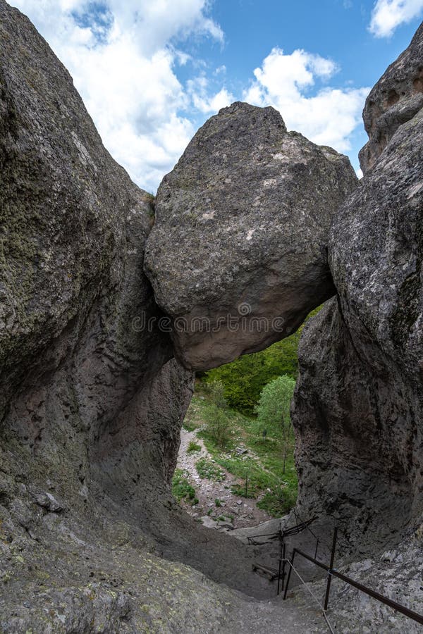 Stuck stone in the rocks stock photo. Image of stuck - 248143020