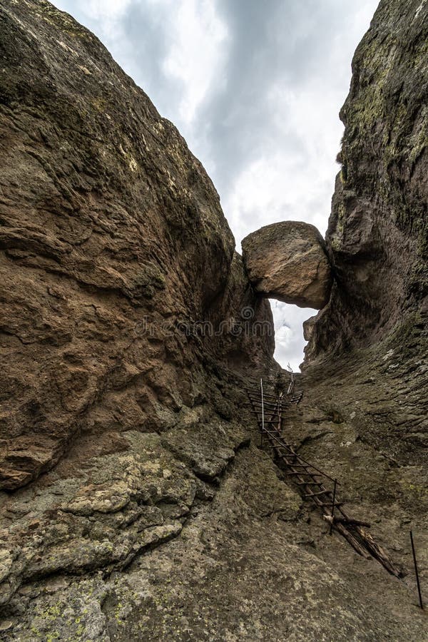 Stuck stone in the rocks stock image. Image of rock - 248143081