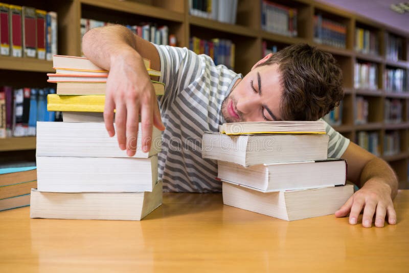Student asleep on a desk stock image. Image of academic - 58129293
