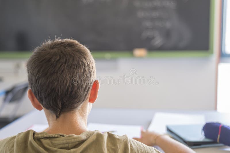 Student Attending in a Classroom during a Lesson Stock Image - Image of ...