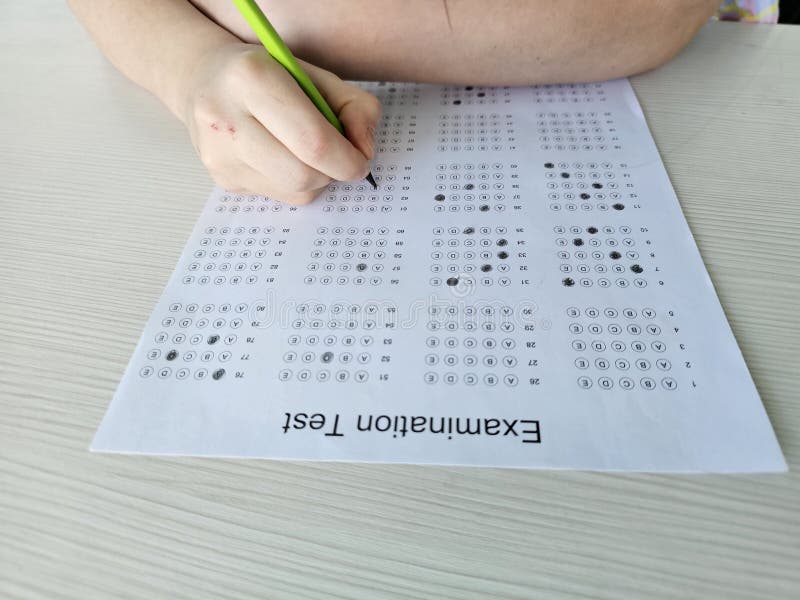 A Student Attentively Completes a Visual Examination Test on a Printed ...