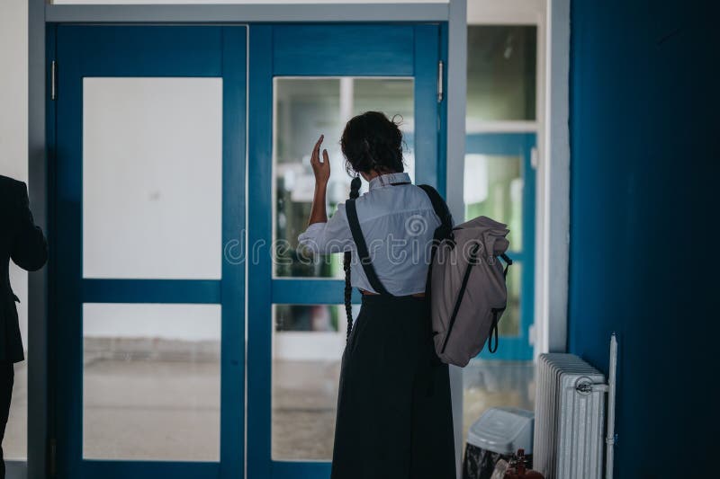 Student Interacting with Professor Outside Classroom during a Break ...