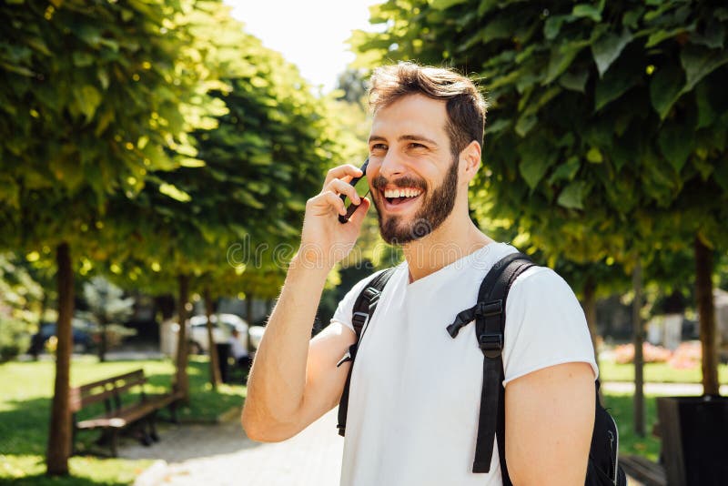 Student with Backpack Talking at Cellphone Stock Photo - Image of smile ...