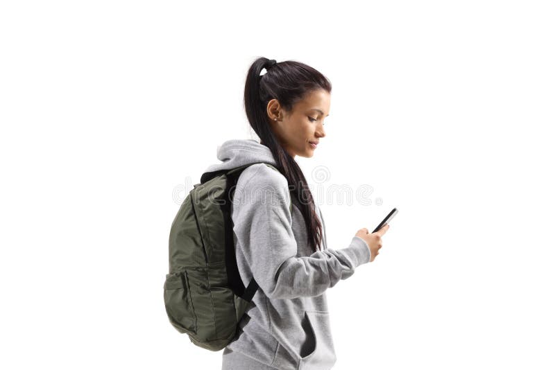 Student with a Backpack Walking and Looking into a Mobile Phone Stock ...