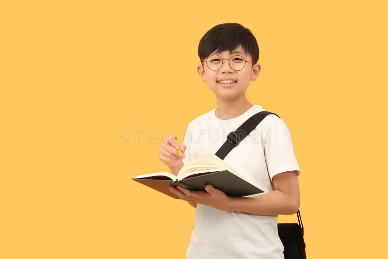 A Student with a Book is Smiling Happily with a Bright Expression ...