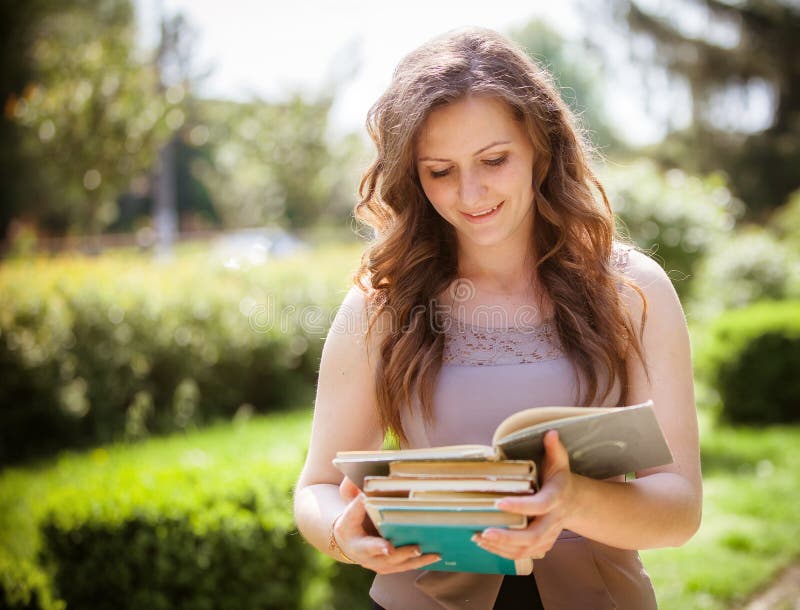 Student with a Book on Street Stock Image - Image of attractive ...