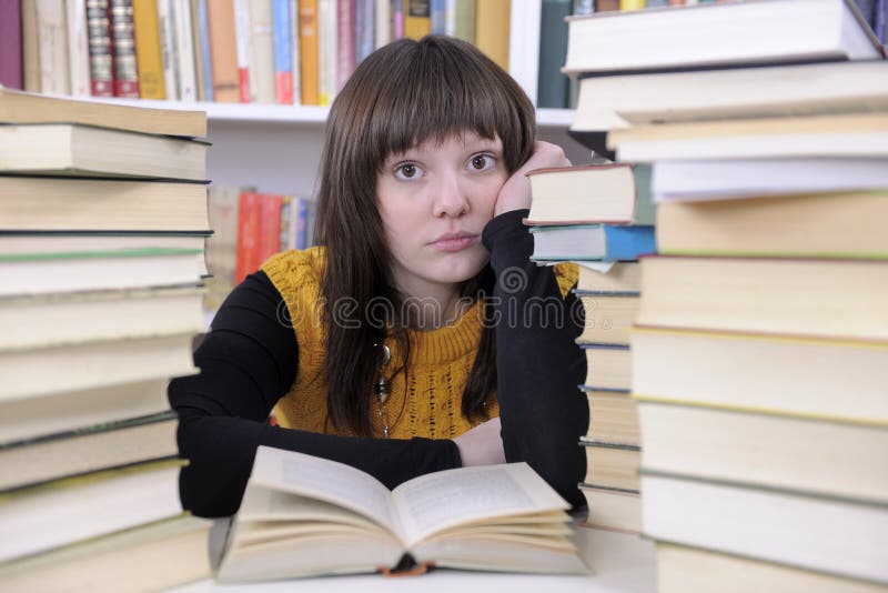 Student with Books in a Library Stock Photo - Image of books, overload ...