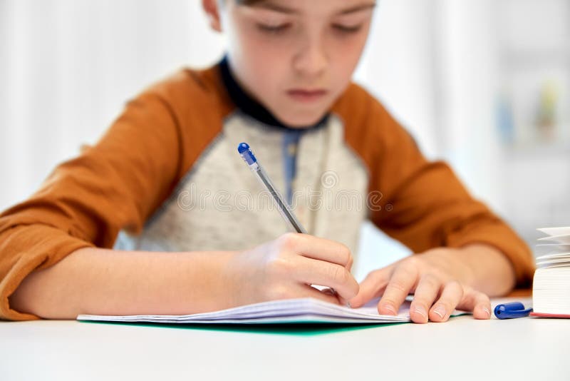 Student Boy with Book Writing To Notebook at Home Stock Image - Image ...