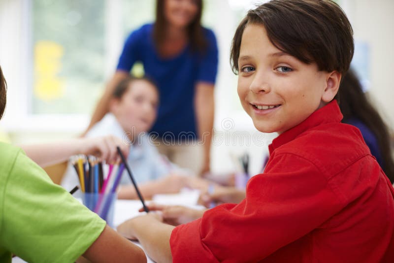 Student Boy in the Classroom Stock Image - Image of friends, books ...