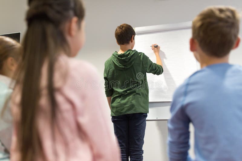 Student Boy with Marker Writing on Flip Board Stock Image - Image of ...