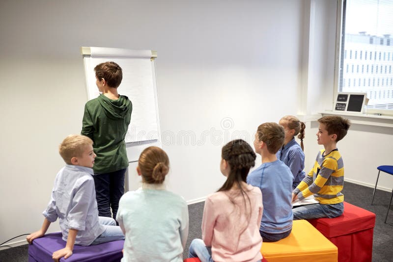 Student Boy with Marker Writing on Flip Board Stock Image - Image of ...