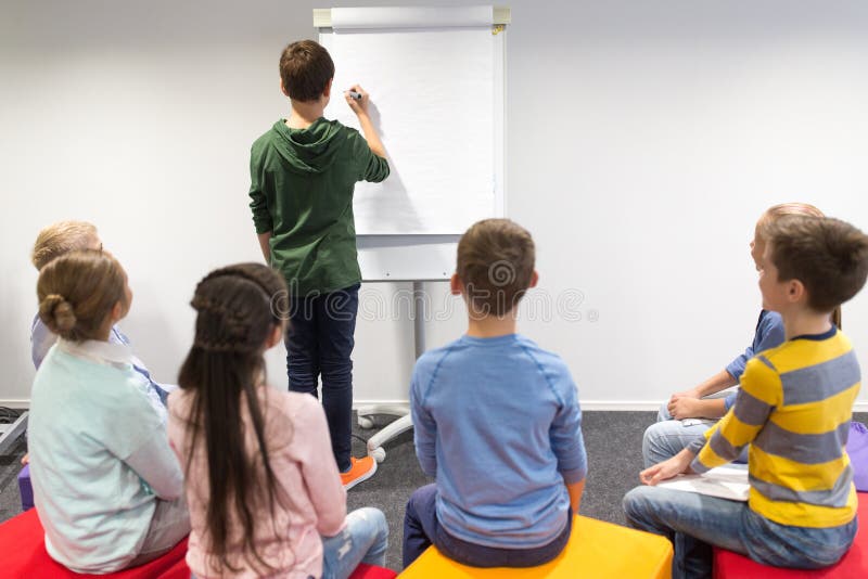 Student Boy with Marker Writing on Flip Board Stock Image - Image of ...